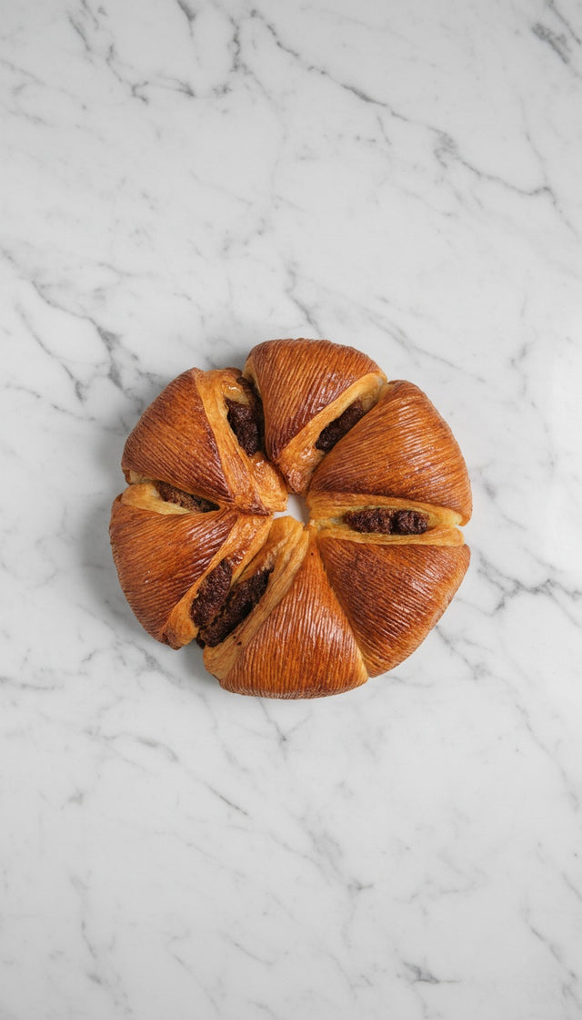 Chocolate Pain Swiss with Sauce – Laura Bakery & Cafe